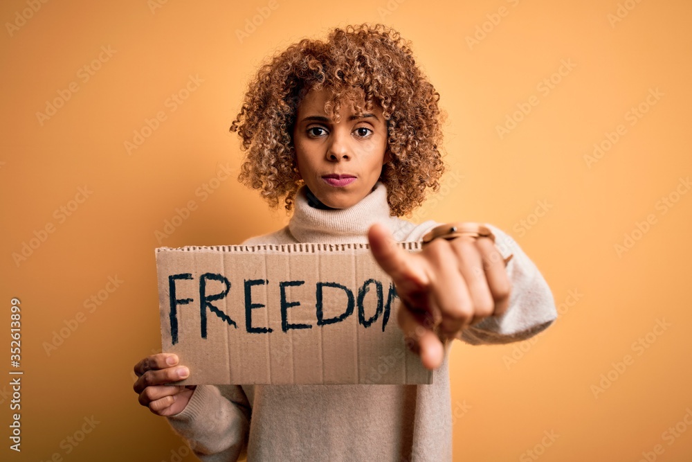 African american activist woman asking for liberty holding banner with ...