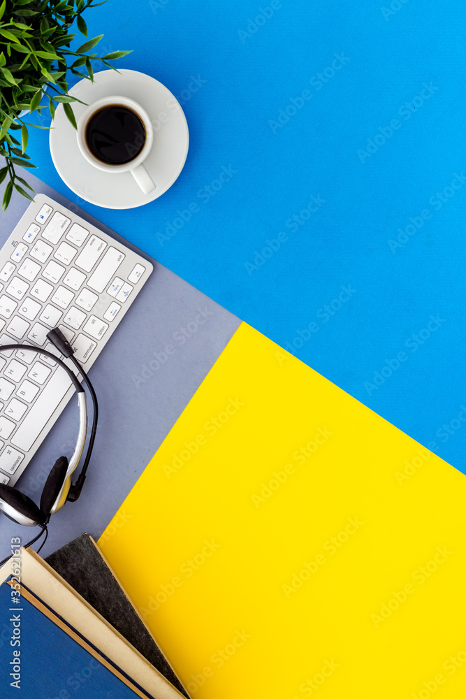 E-learning, online course. Computer, book and headphones on colorful ...