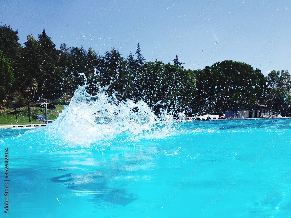 Water Splashing In Swimming Pool Stock Photo | Adobe Stock