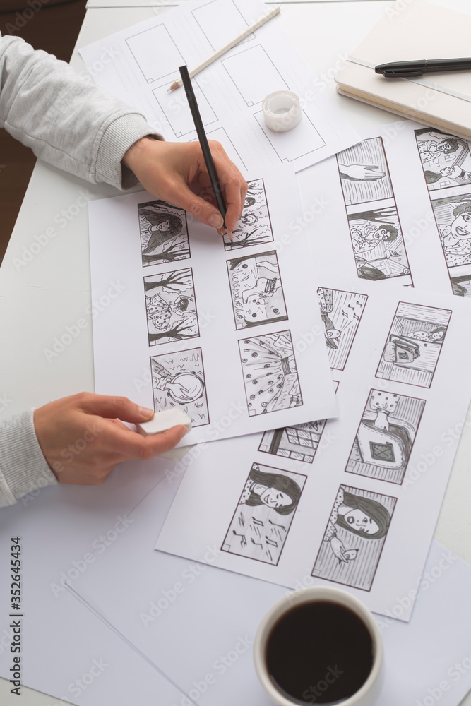Hands of the artist draw a storyboard on paper. Storytelling. Story ...
