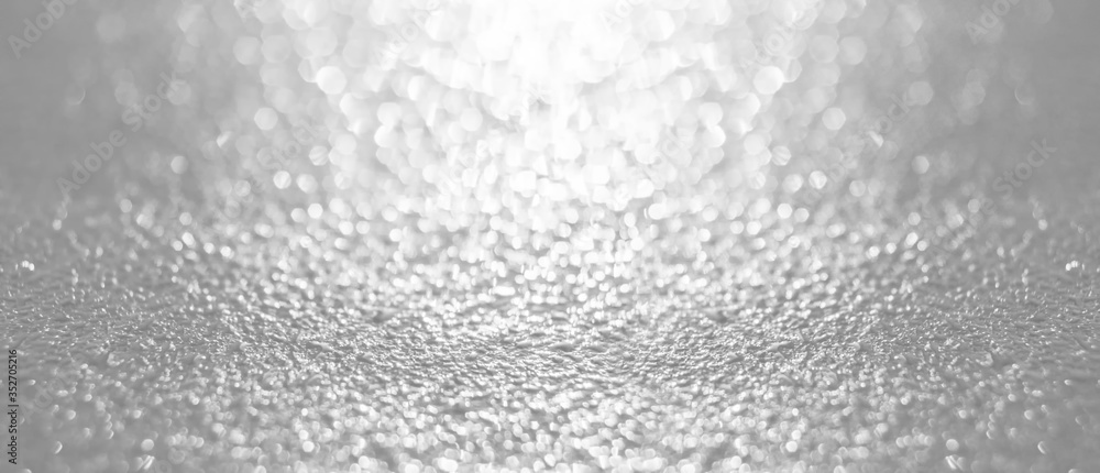 Abstract of Bright and sparkling bokeh background. silver and diamond dust bokeh blurred ...