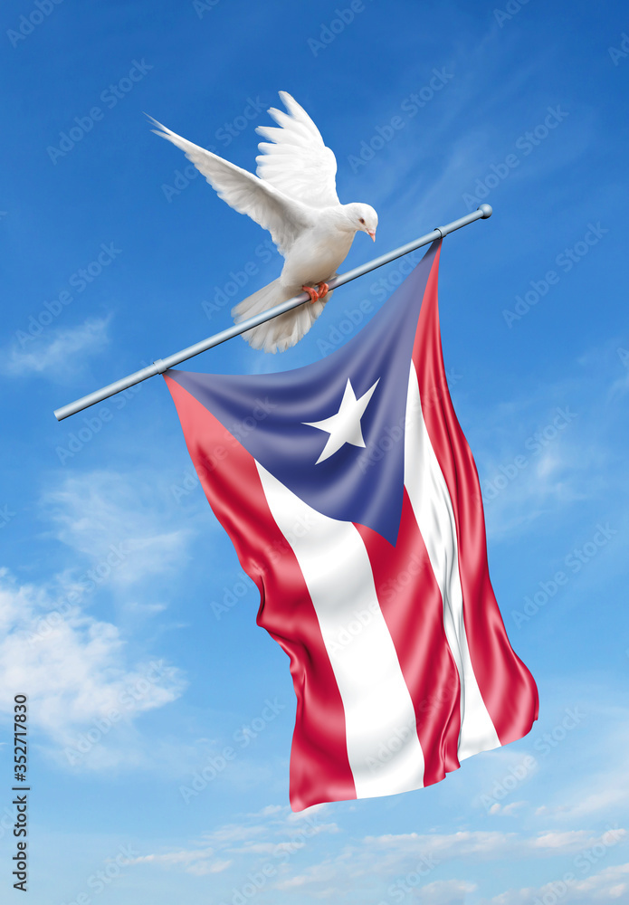 Puerto Rico flag on a pole is carried by a bird while flying against a ...