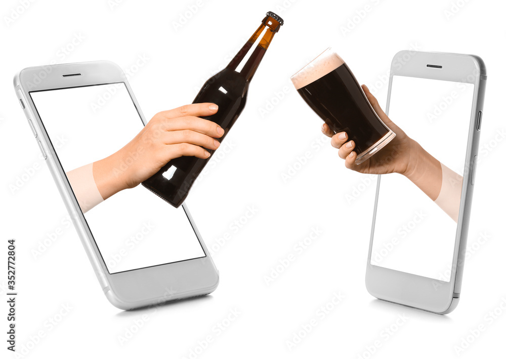 People drinking beer through screens of mobile phones against white ...