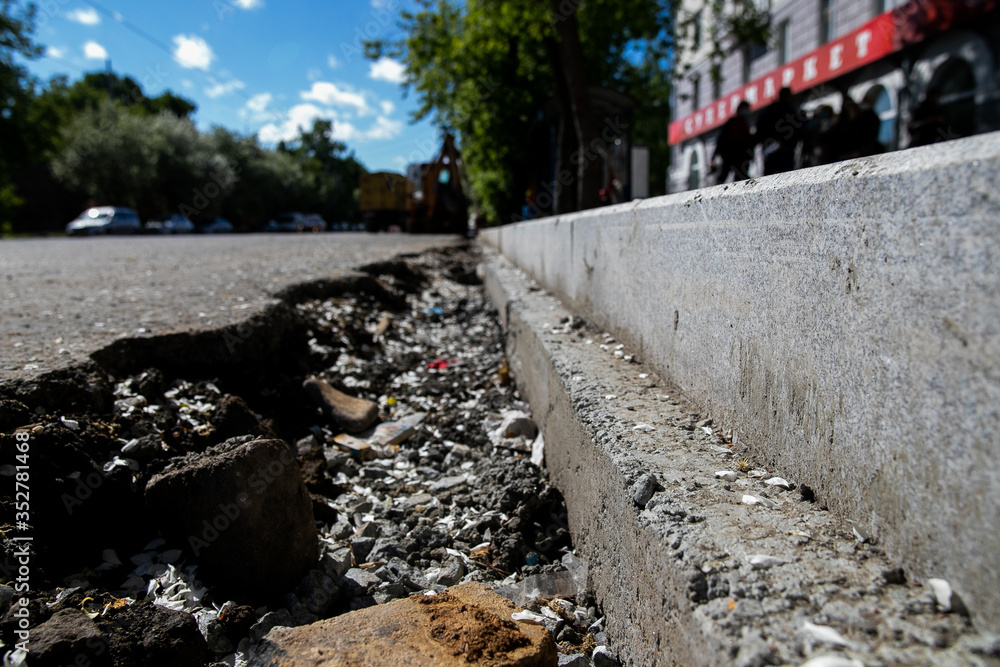 Setting road border before laying asphalt. Reconstruction of the ...