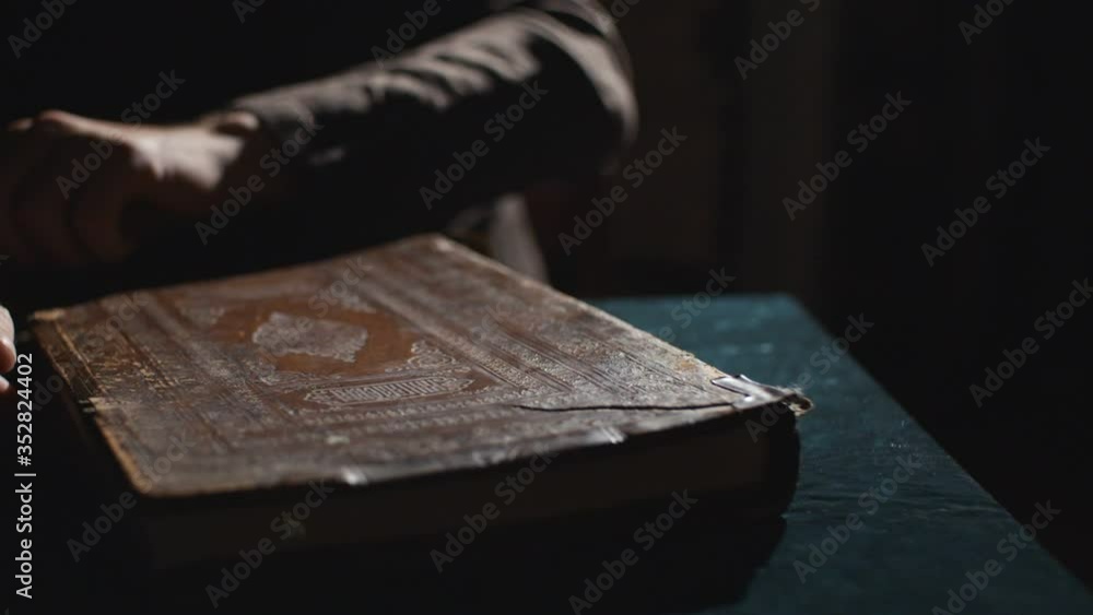 Monk is reading an old book Stock Video | Adobe Stock