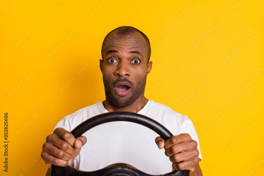Portrait of astonished afro american driver hold steering wheel ...