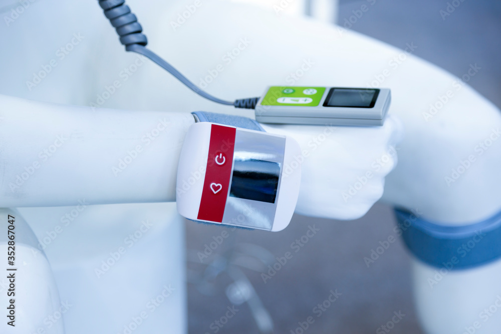 diagnostic physiotherapy sensors on the arm of human mannequin. Medical ...