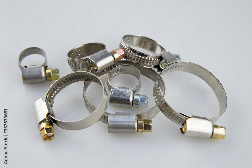 Worm and pipe clamps for construction, different sizes. Stock Photo ...