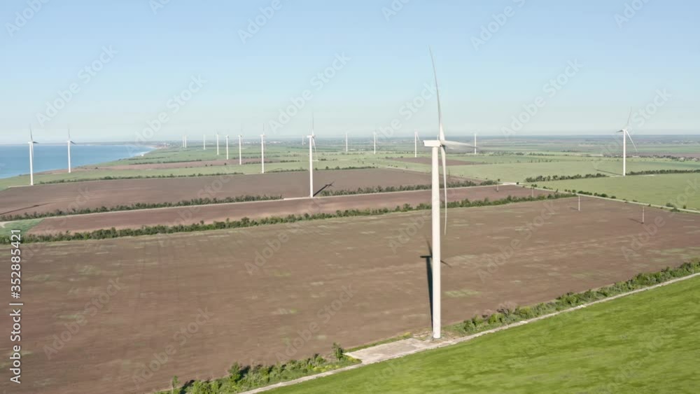 Spinning Wind Turbines Spring Landscape. Green Ecological Power Energy ...
