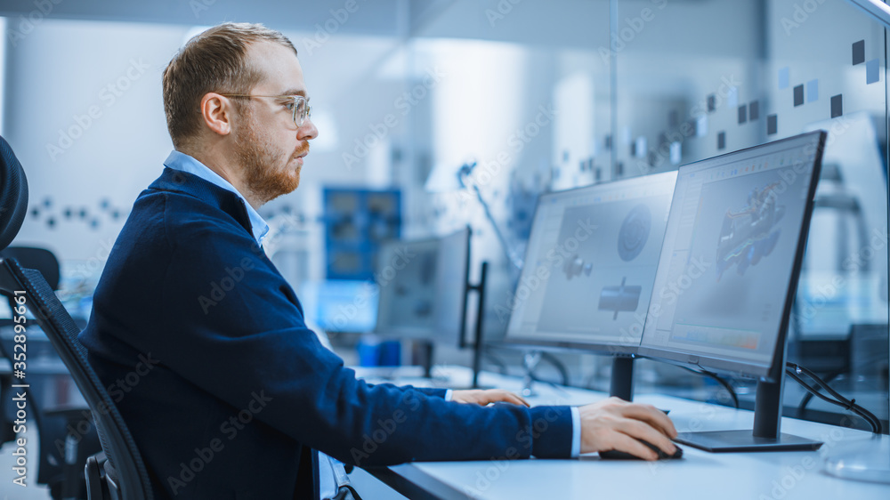 Shot of a Heavy Industry Engineer Working on Personal Computer, Screen ...