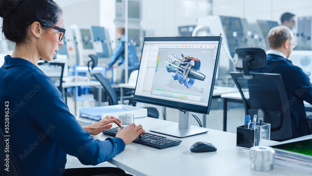 Industrial female Engineer Working on a Personal Computer, Screen Shows ...