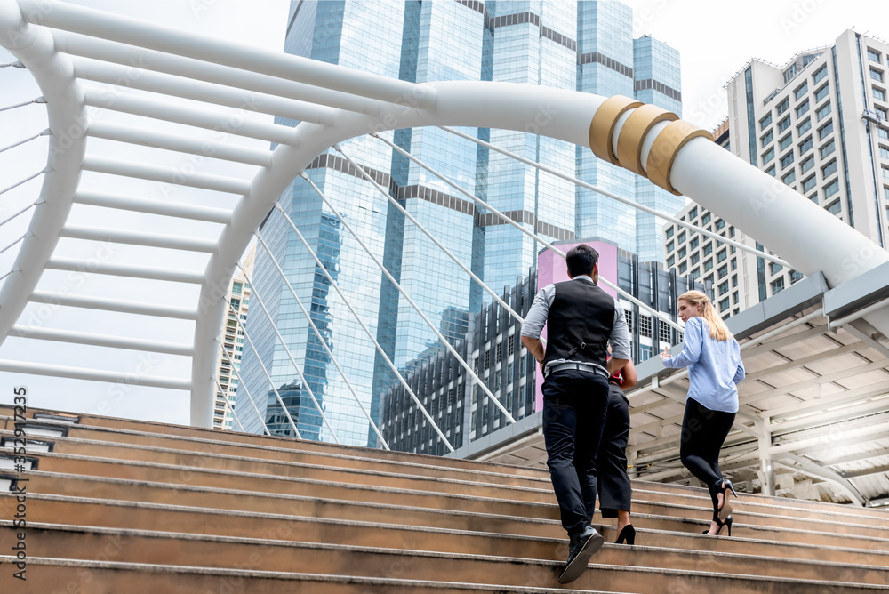Businessmen team, group Walking up the stairs in the downtown area Full ...