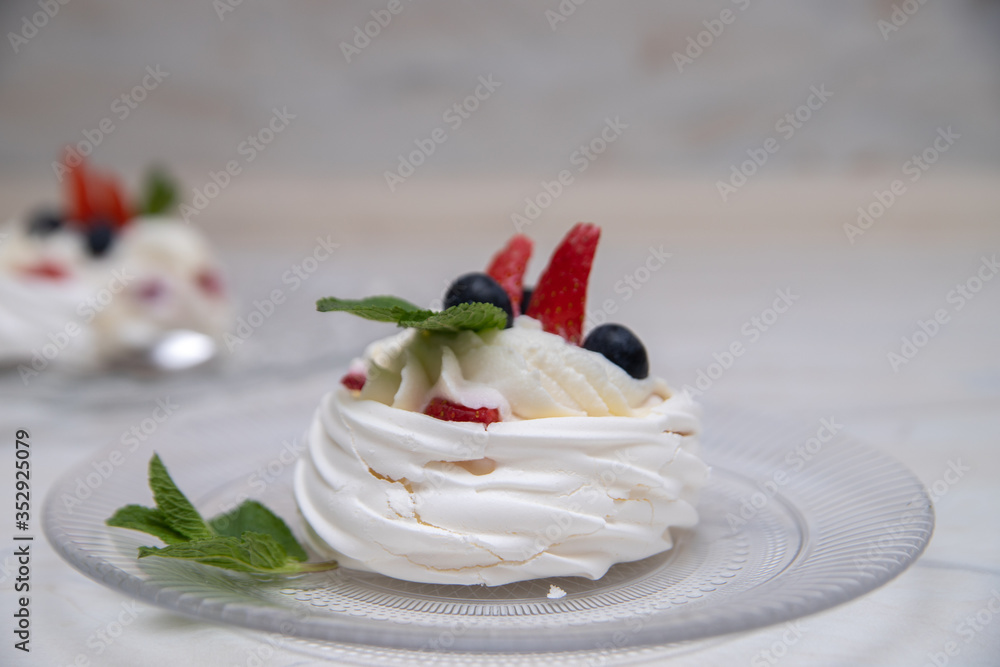 Delicious crunchy meringue cake with fresh berries. Strawberries and ...