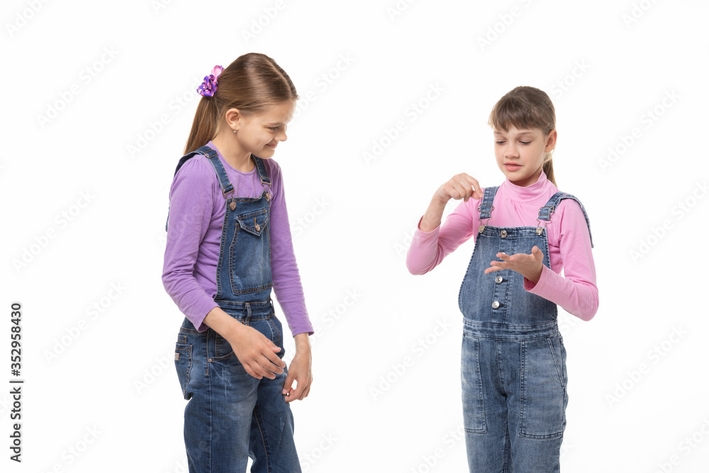 The girl explains to her sister the meaning of the hidden word in the ...