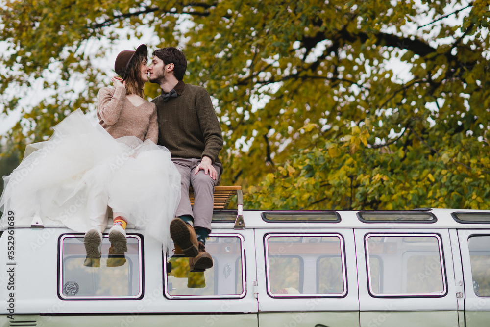 Romantic and happy caucasian couple in casual wedding clothes hugging ...