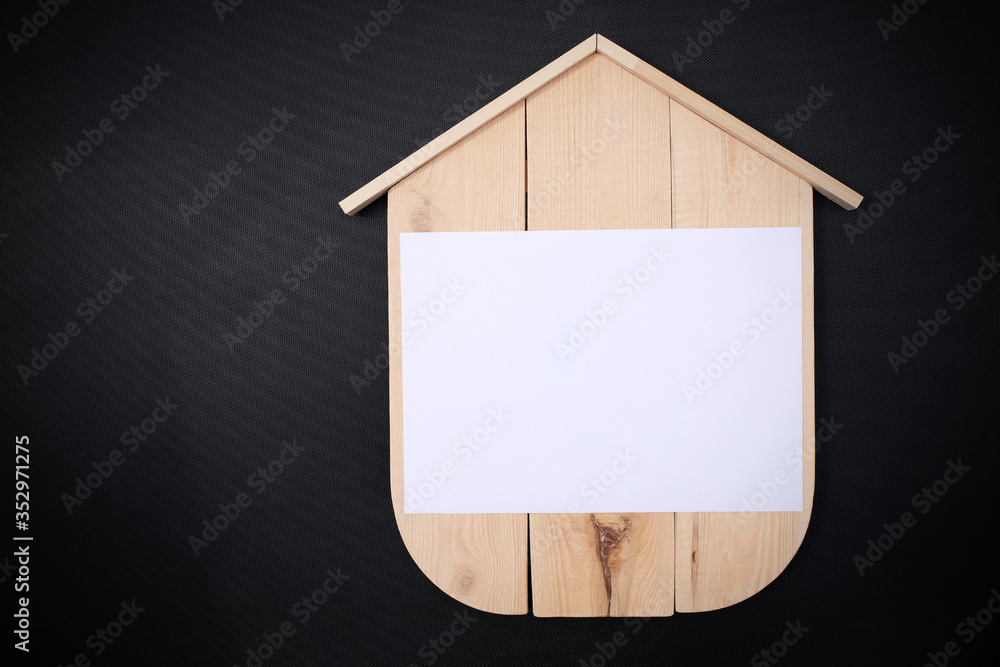 Blank Wood House with blank paper on black background. Concept sale ...