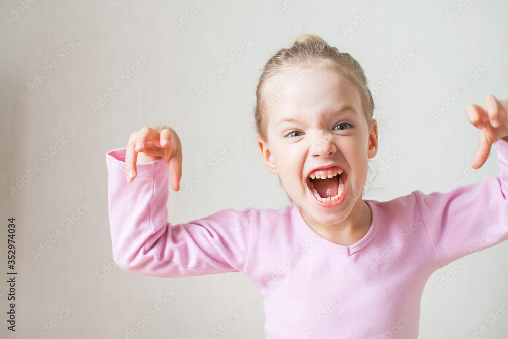 Little cute girl depicts emotions. Scream, anger, rage, wild Stock ...