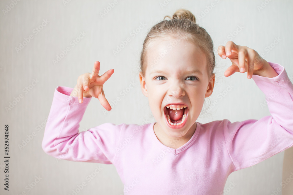 Little cute girl depicts emotions. Scream, anger, rage, wild Stock ...