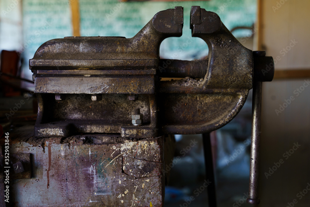 Old rusty steel clamp vise iron metal tool in the workshop workbench in ...