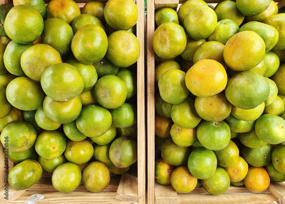 Organic tangerine that is sold in front of the fruit shop Orange is a ...