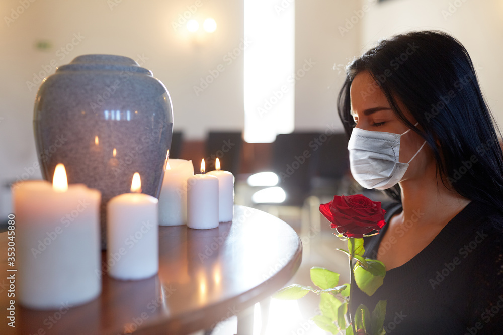 burial, people and mourning concept - sad woman wearing face protective ...