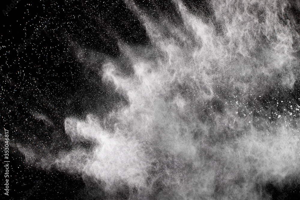 Bizarre forms of white powder explosion cloud against dark background ...
