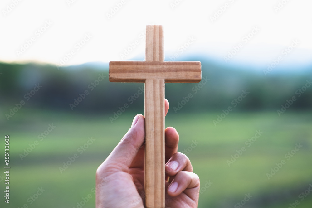 Holding the cross, the symbol of the blessing of Jesus, the symbol of ...