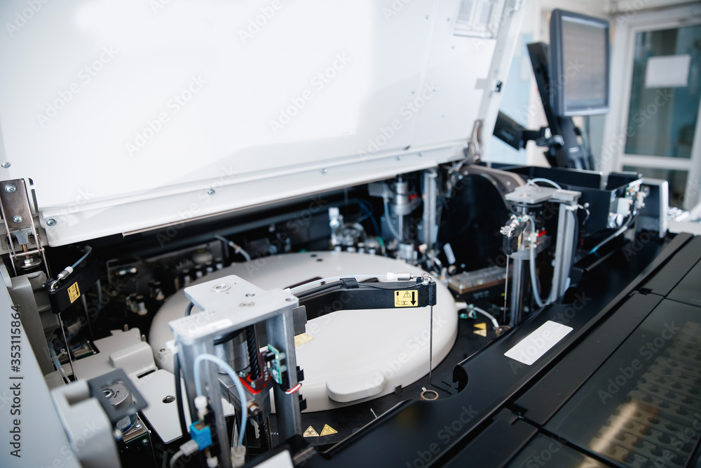 Automatic robot microbiologist analyzing test tube of blood samples for ...