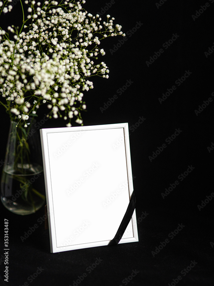 Frame for a photo of the deceased with a black ribbon on a dark ...