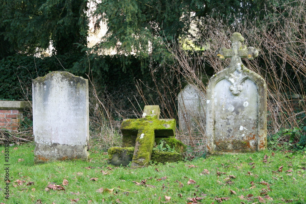 Old tombstones on an old English graveyard. Ancient monument and burial ...