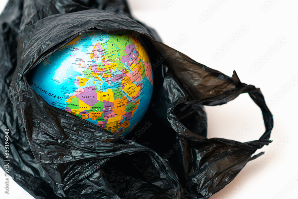 World Globe inside plastic bag you can see in hole different parts of ...
