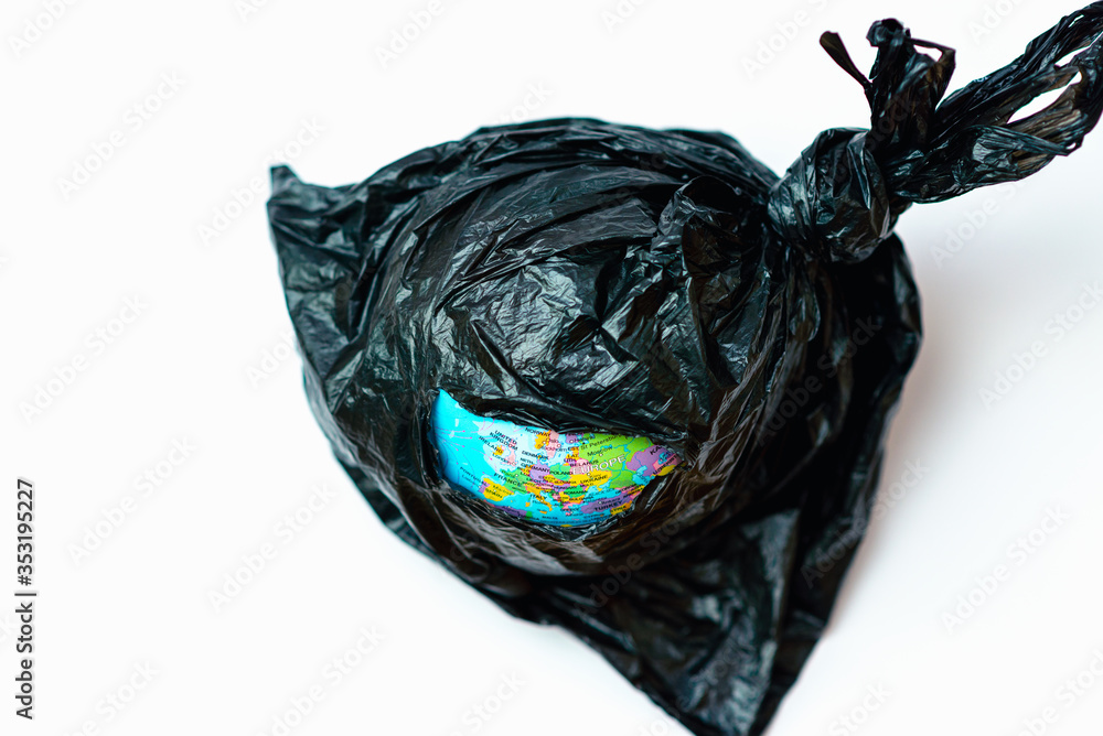 World Globe inside plastic bag you can see in hole different parts of ...