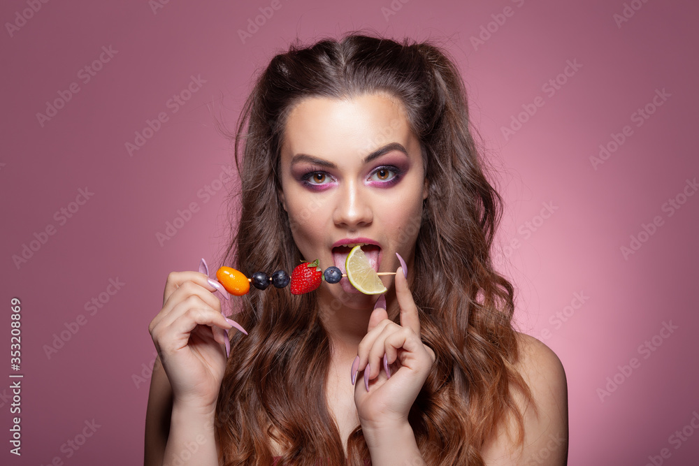 Young sexy woman eating fruit skewer Stock Photo | Adobe Stock Young sexy woman eating fruit skewer Stock Photo | Adobe Stock