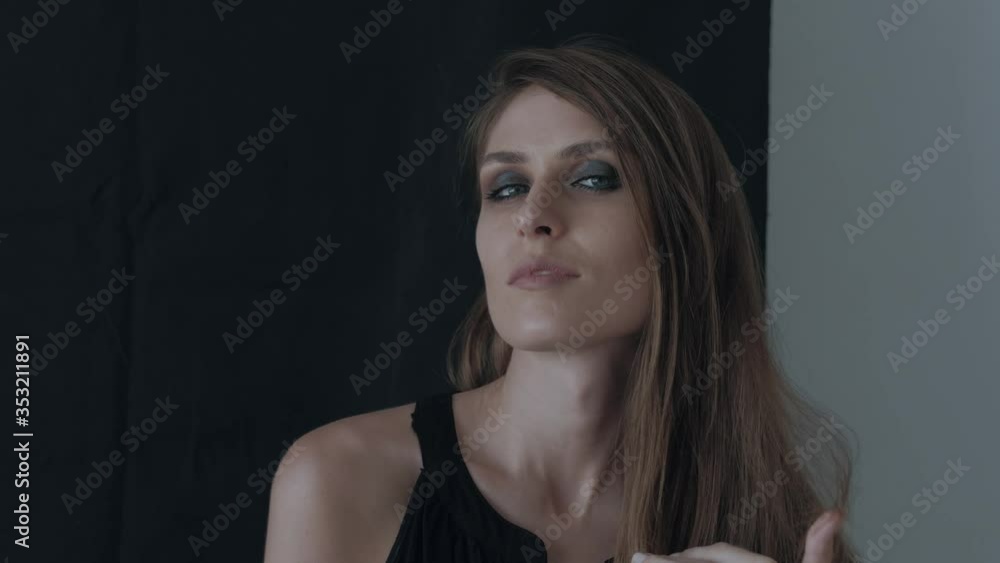 Beautiful Fashion Model Wearing Black Strikes A Pose For Shooting In ...
