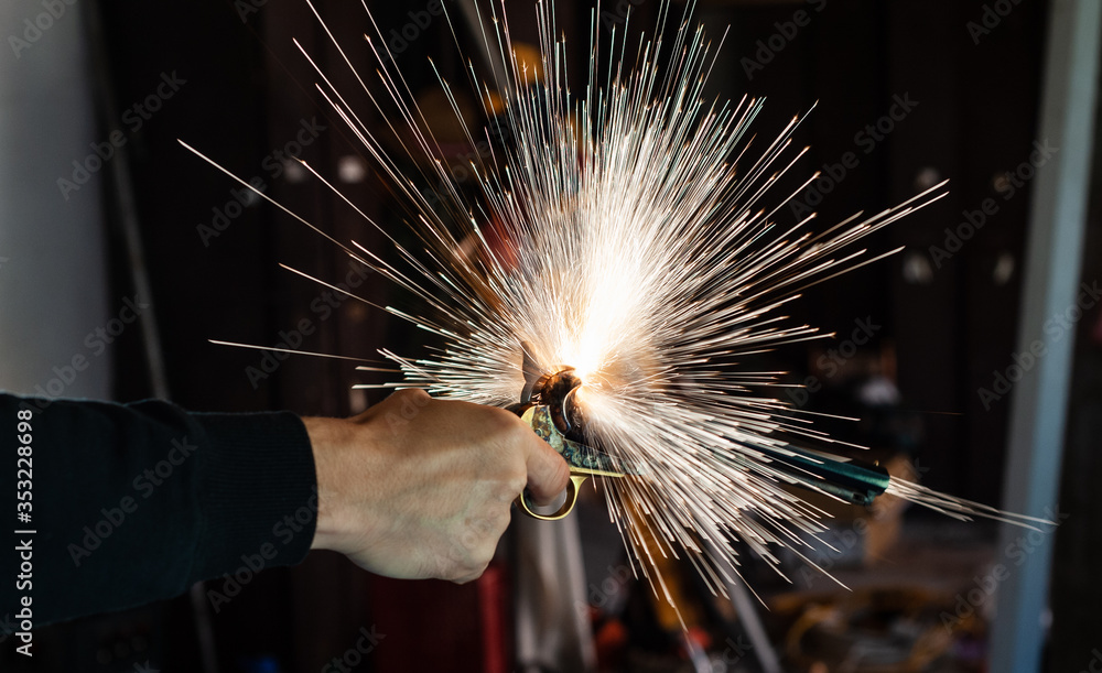 Side view of a hand holding an old cowboy gun. Big bang, smoke and ...