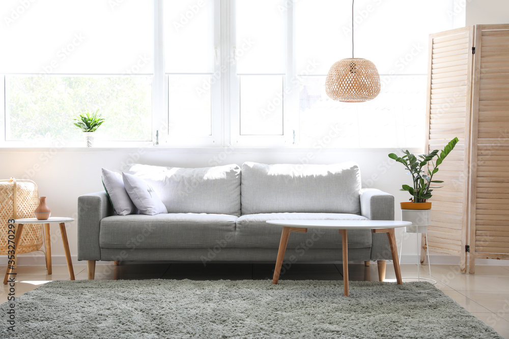 Stylish interior of living room with sofa and lamp Stock Photo | Adobe ...