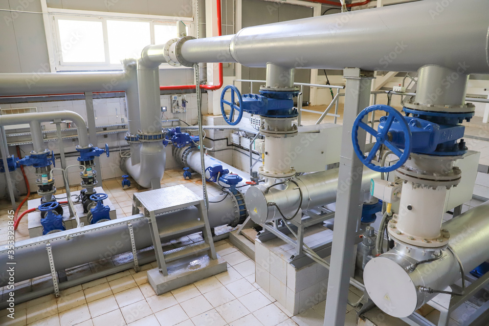 Modern pumping station at the water intake. Pipes, electric motors ...