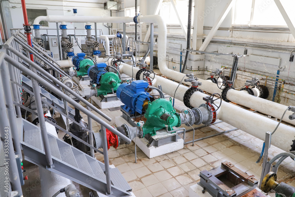 Modern pumping station at the water intake. Pipes, electric motors ...