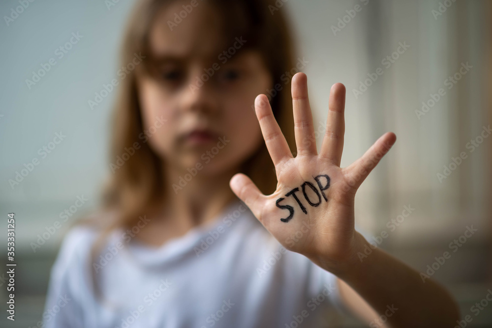 The child makes a stop gesture with his hand. Stop domestic and child ...