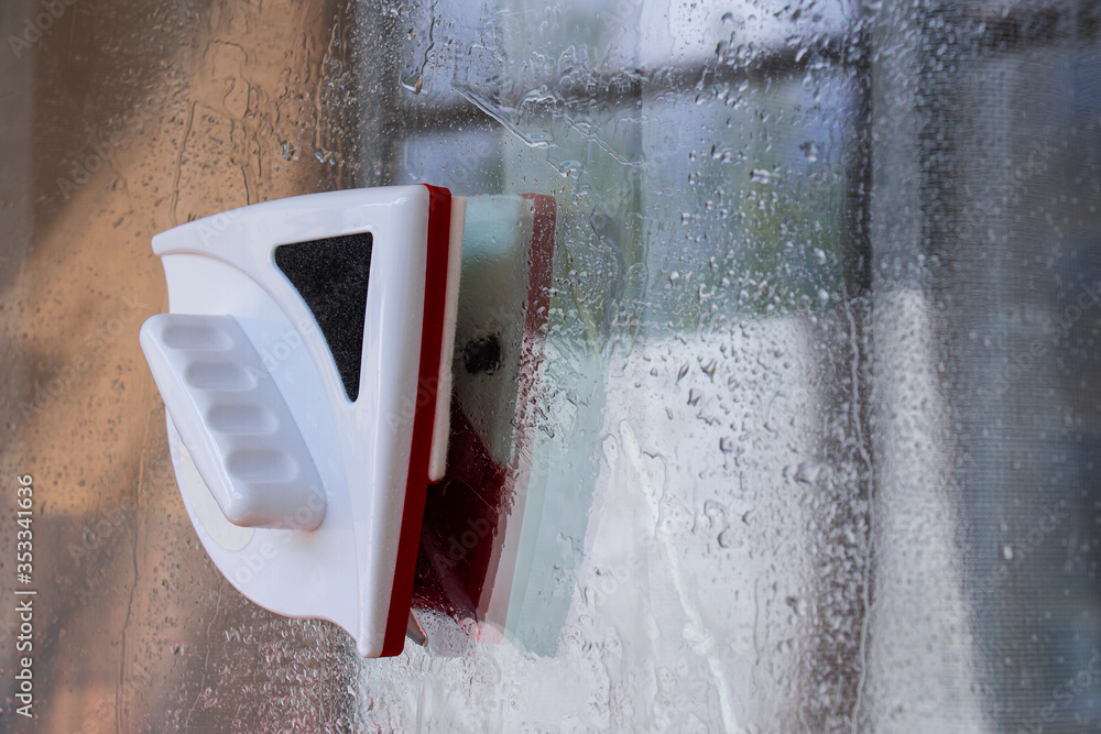 girl hand washing window cleaning with a mop. Window cleaning with a ...
