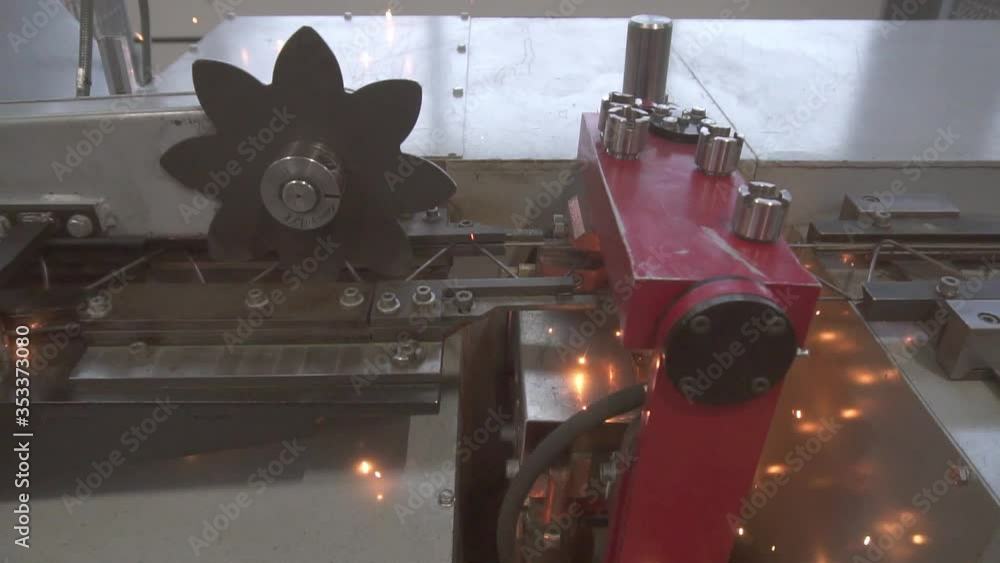 Sparks fly. Production of reinforcing mesh on automated lines. Machine ...
