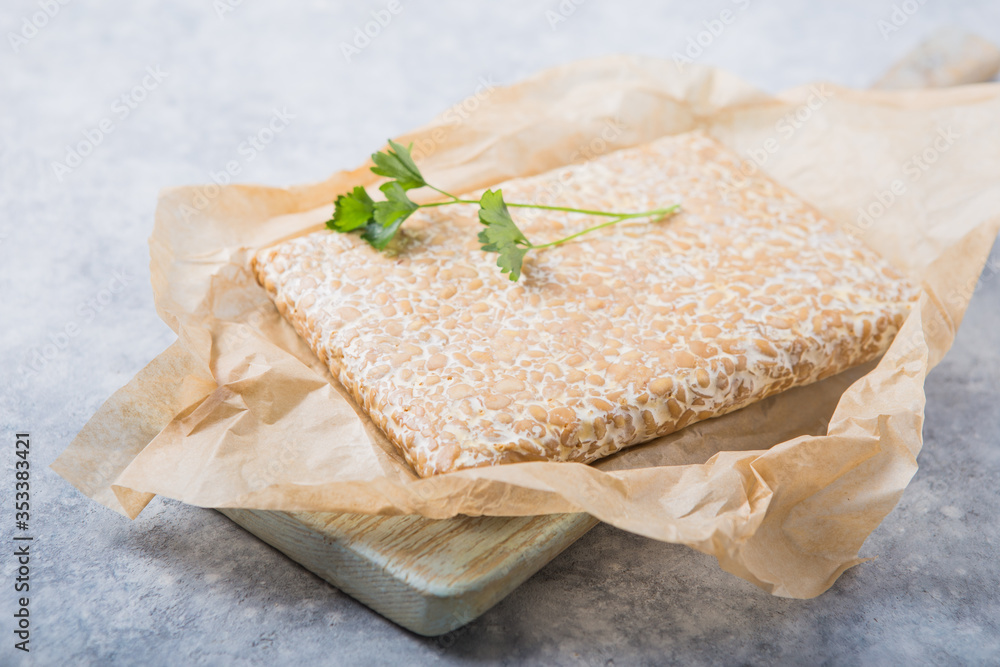 Slice of tempeh or tempe made of fermentation process that binds ...