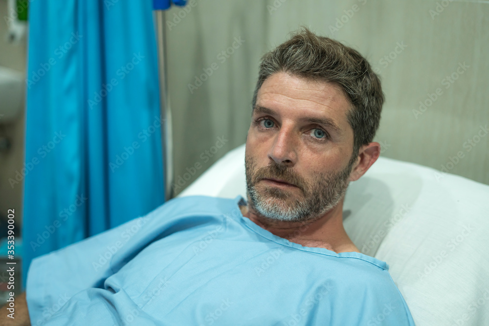 scared and worried man hospitalized - attractive injured man lying on ...