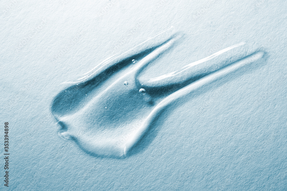 Transparent gel with bubbles close-up. Smear of face gel cream. The ...