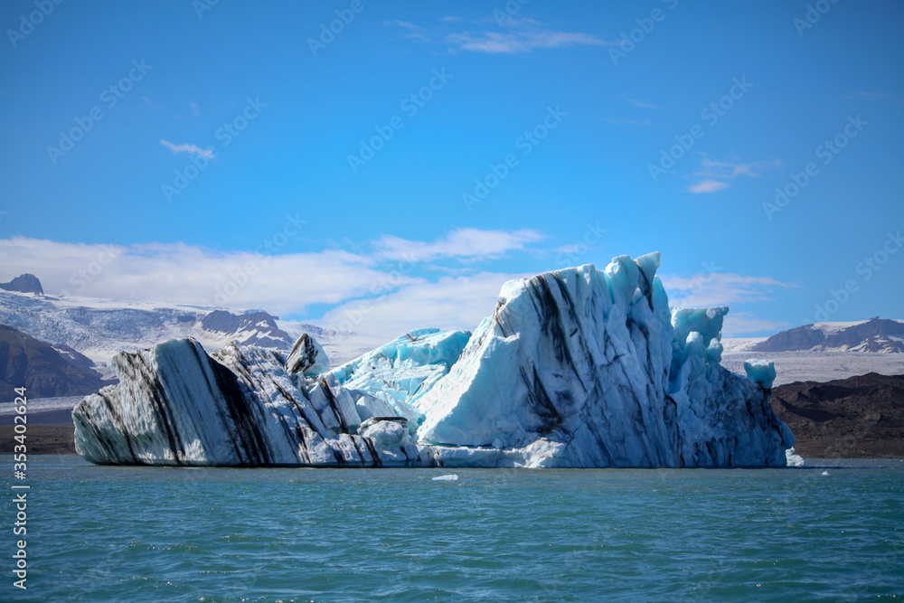 Icebergs floating. Ices and volcanic ash. Glacier lagoon. Melting ice ...