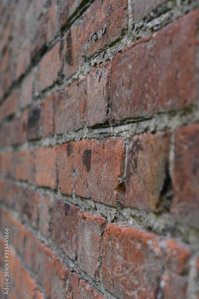 Very close angled view of the red brick wall pattern a close up ...