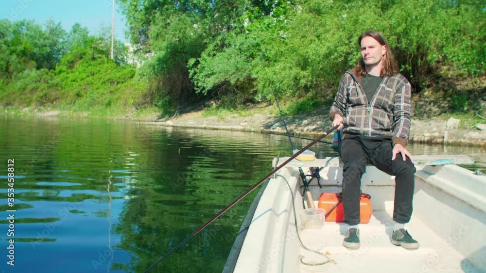 Relaxed fishing from boat in shallow water Stock ビデオ | Adobe Stock