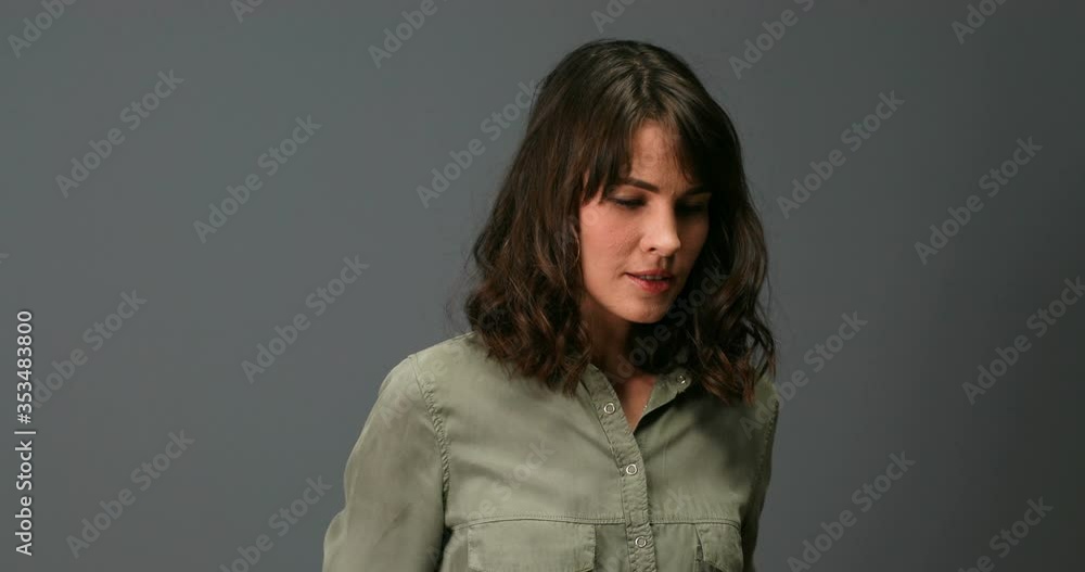 Portrait of beautiful angry young woman tearing the paper while ...