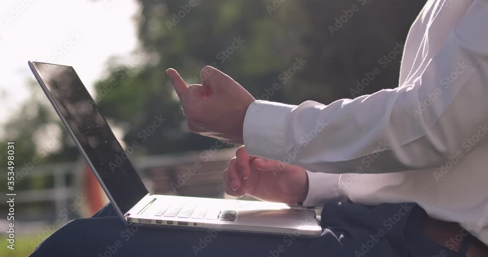 Businessman works on a laptop and shows indecent gesture - middle ...