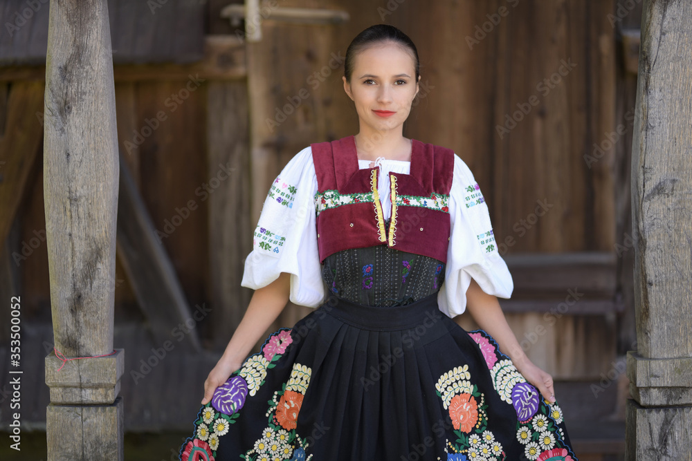 Young beautiful slovak woman in traditional costume. Slovak folklore ...